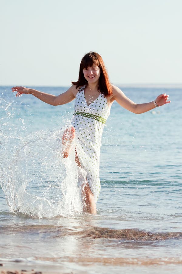 Happy woman on sea beach stock image. Image of blue, adult - 23037905
