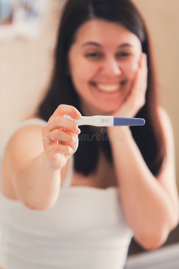 Happy Woman Showing Positive Pregnancy Test Stock Photo - Image of ... Happy Woman Showing Positive Pregnancy Test Stock Photo - Image of ...