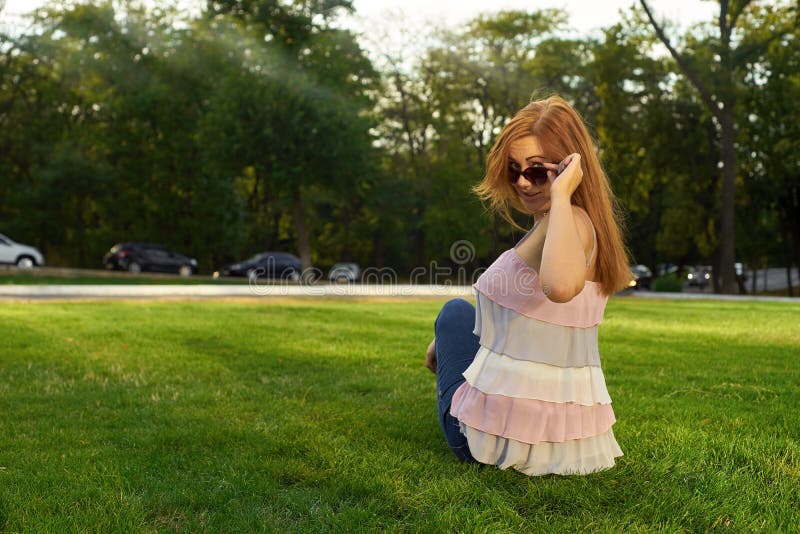 Happy Woman Sitting on the Grass Stock Image - Image of ideas ...