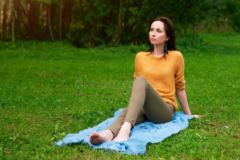 Happy Woman Sitting on the Grass in the Park Resting Stock Image ...