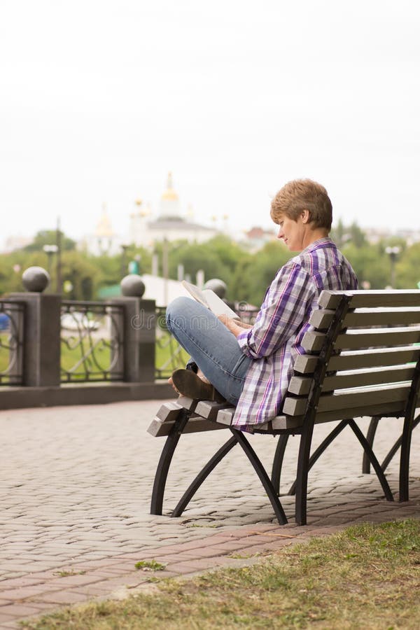 Happy Woman Sitting and Reading a Book Stock Image - Image of reading ...