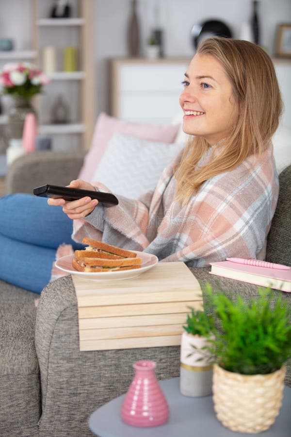 Happy Woman Snacking and Zapping Stock Image - Image of caucasian ...
