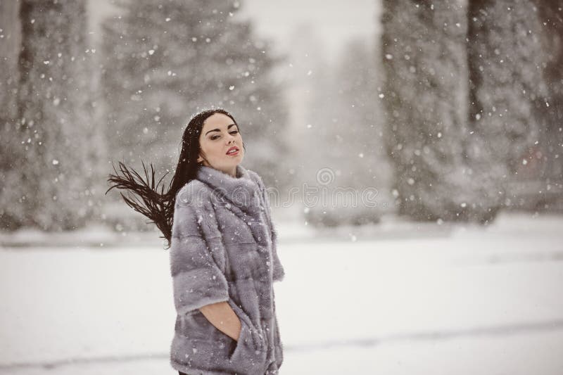 Happy Woman in a Snowy Winter Day Stock Image - Image of frozen, joyful ...