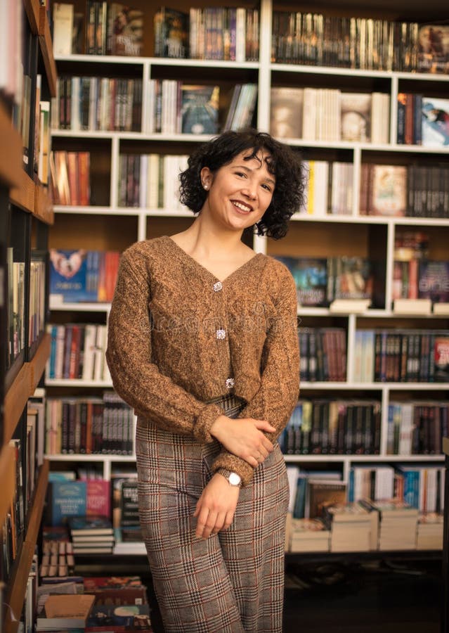 Woman Standing in Library and Looking at Camera Stock Photo - Image of ...