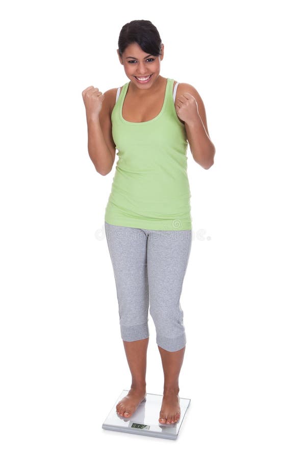 Happy Woman Standing on Weighing Scale Stock Image - Image of human ...