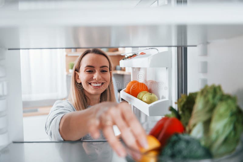 Happy Woman Taking Vegetable from the Fridge Stock Image - Image of ...