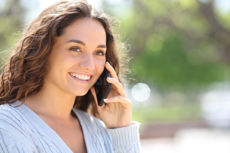 Happy Woman Talks on Phone Outside Stock Photo - Image of service ...