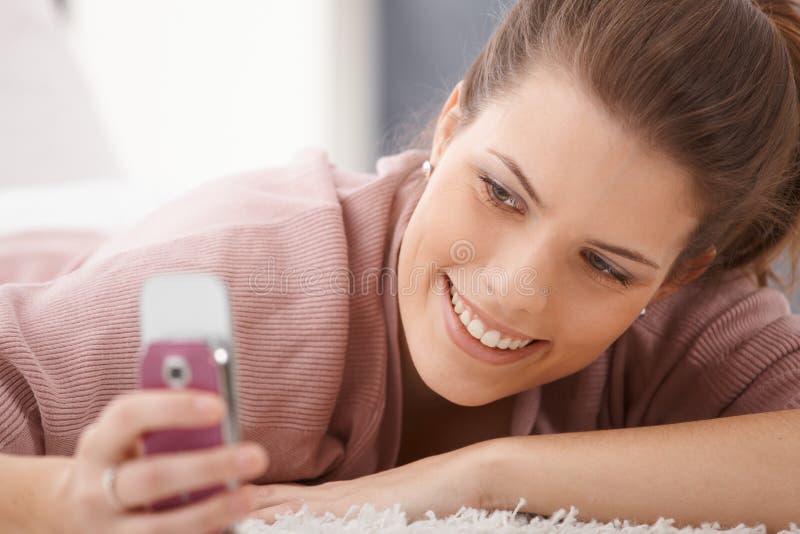 Happy woman texting stock image. Image of attractive - 21229349