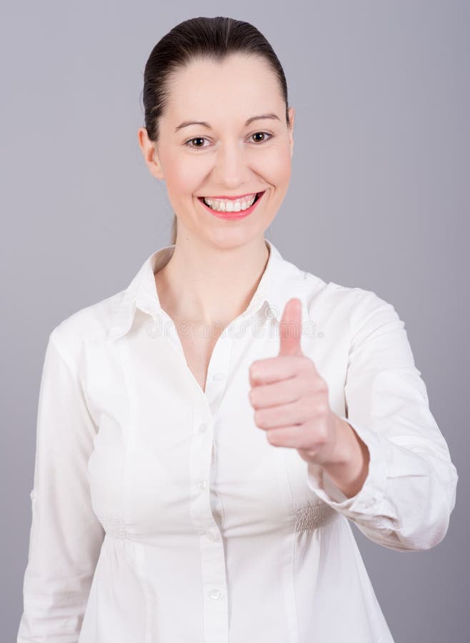 Happy woman with thumbs up stock image. Image of board - 28123093