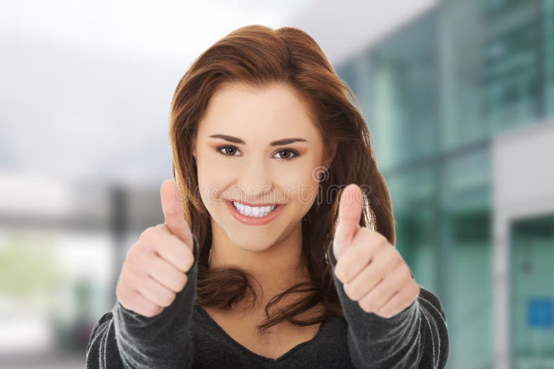 Happy woman with thumbs up stock image. Image of portrait - 48692079