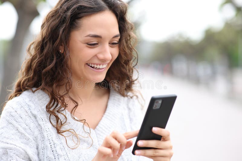 Happy Woman Using Cell Phone Outside Stock Image - Image of checking ...