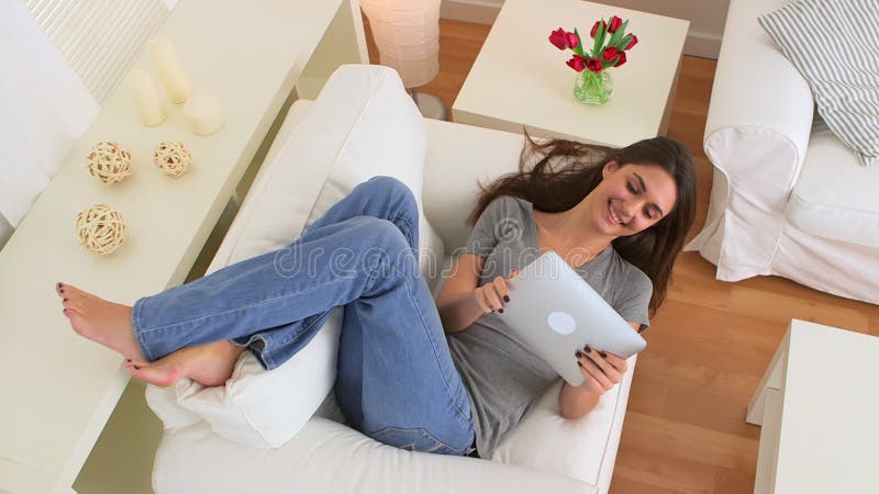 Happy Woman Using Ipad on Couch Stock Video - Video of girl, mobile ...