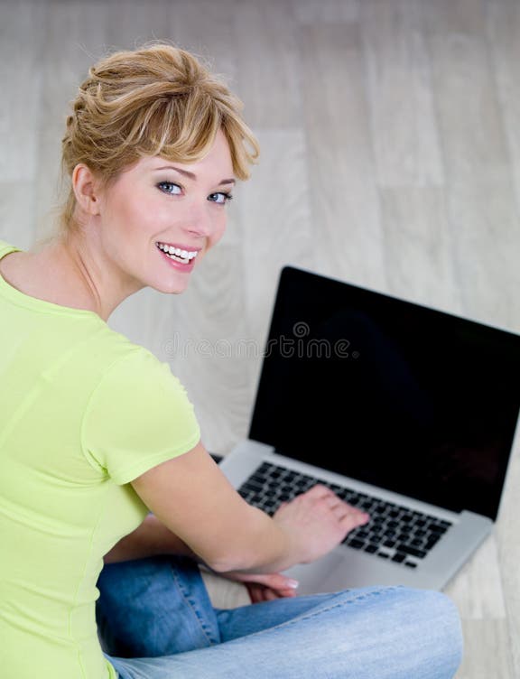 Happy woman using laptop stock photo. Image of indoors - 14112236