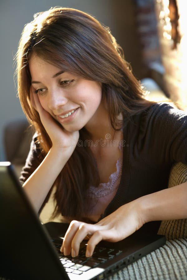 Smiling Woman Using Computer Stock Photo - Image of relaxing ...