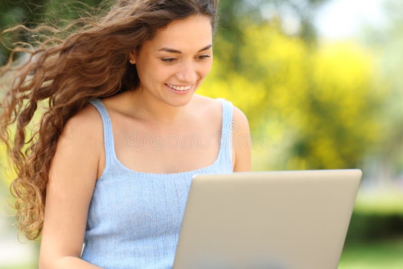 Happy Woman Using Laptop on a Bench Stock Image - Image of woman ...