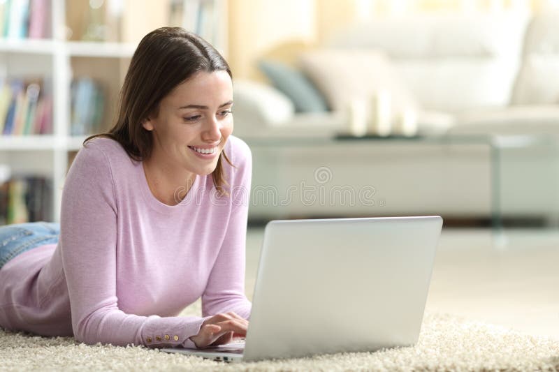 Happy Woman Using Laptop on a Carpet in a House Stock Image - Image of ...