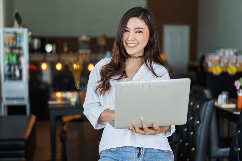 Woman Using Laptop Computer in Cafe Stock Photo - Image of korean ...