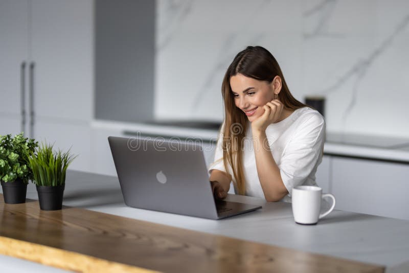 Happy Young Woman Using Laptop in Cook Room Stock Photo - Image of ...