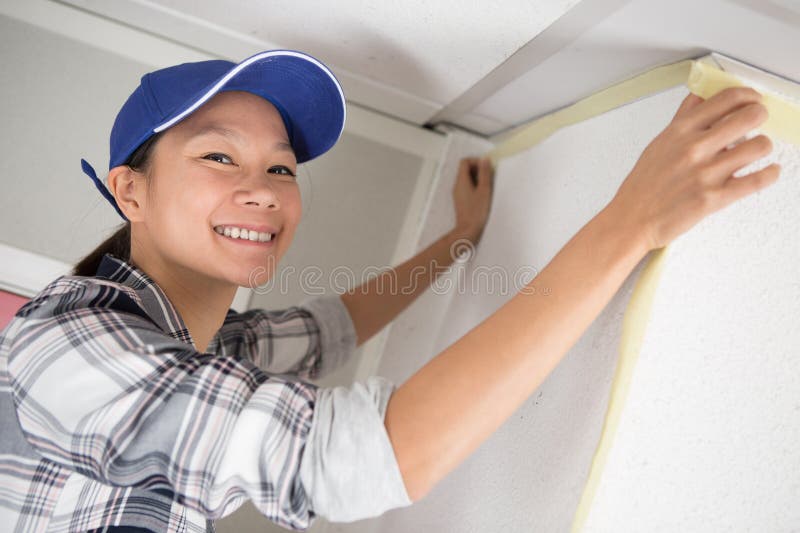 Happy Woman Using Masking Tape Stock Image - Image of person, housing ...