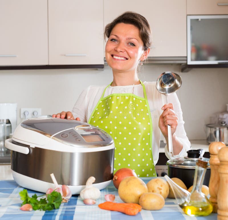 Happy Woman Using Slo-cooker Stock Image - Image of cooker, portrait ...