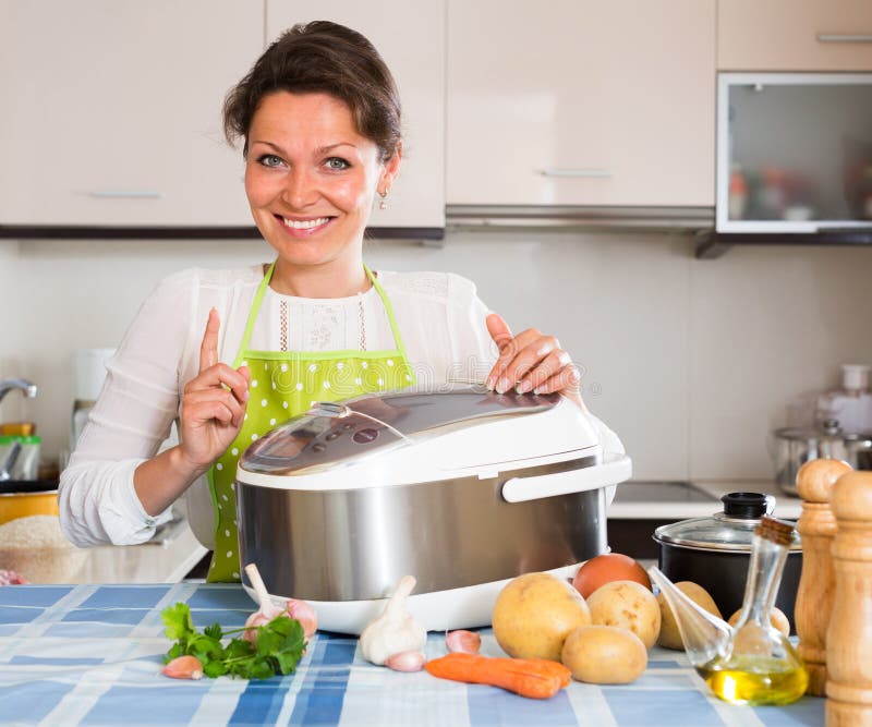 Happy Woman Using Slo-cooker Stock Photo - Image of cook, happy: 55557862