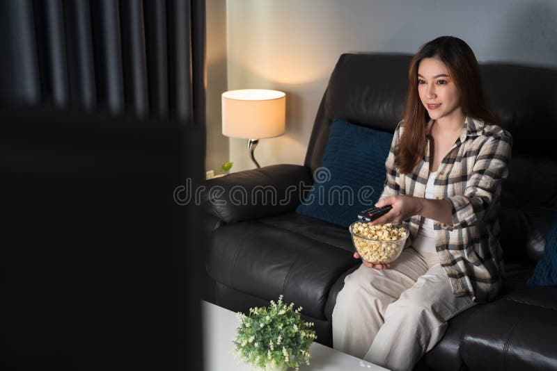 Happy Woman Watching TV on Sofa at Night Stock Photo - Image of ...