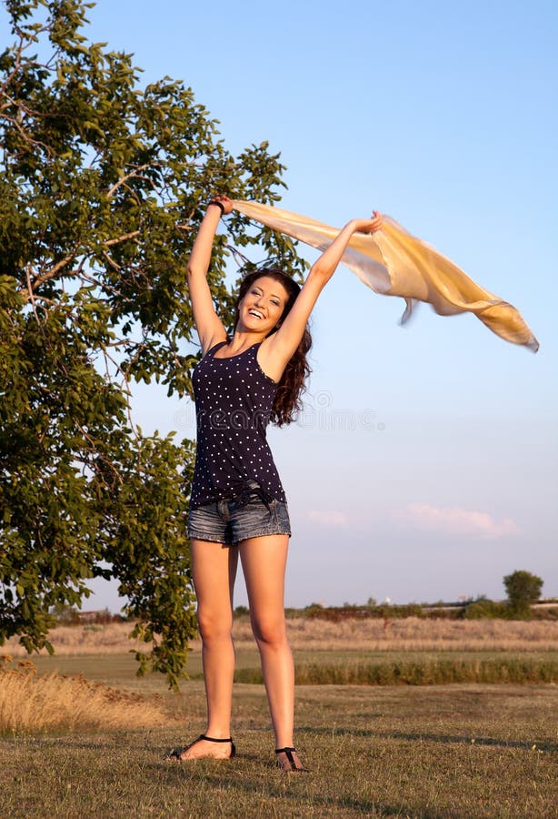 Happy woman in the wind stock image. Image of shawl, meadow - 31620293