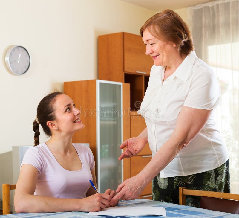 Happy Women with Financial Documents at Table Stock Photo - Image of ...