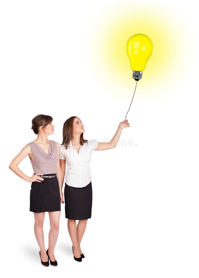 Happy Women Holding a Light Bulb Balloon Stock Photo - Image of bunch ...