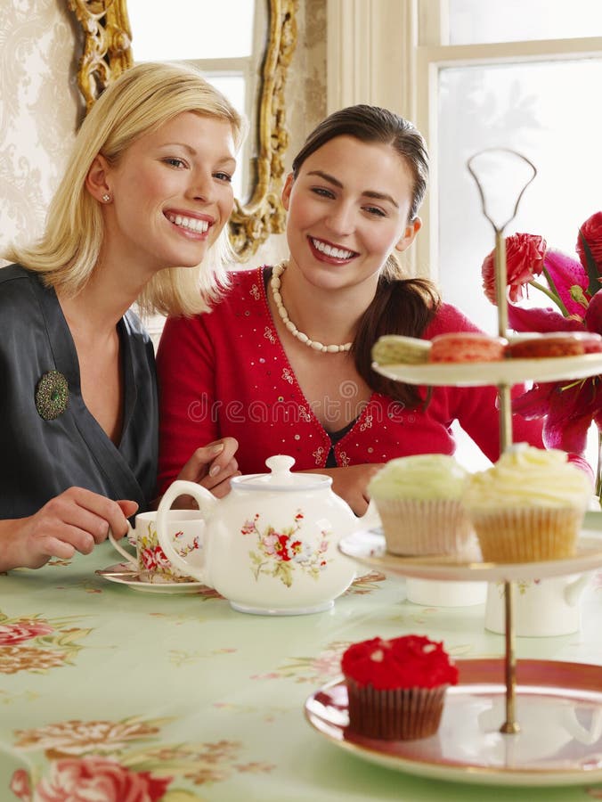 Happy Women Sitting at Dining Table Stock Image - Image of beautiful ...