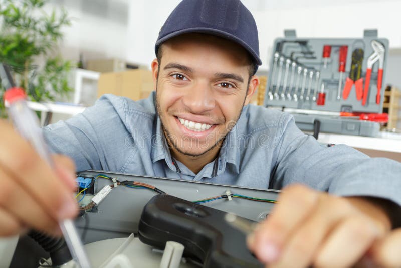 Happy Worker Fixing Machine Stock Photo - Image of calibrating, laborer ...