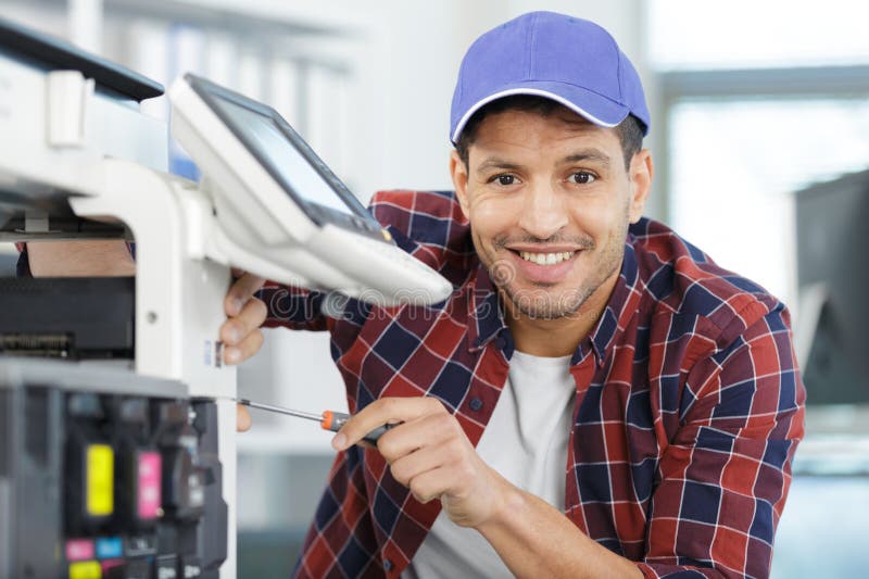 Happy Worker Holds Screwdriver for Fixing Printer Stock Photo - Image ...