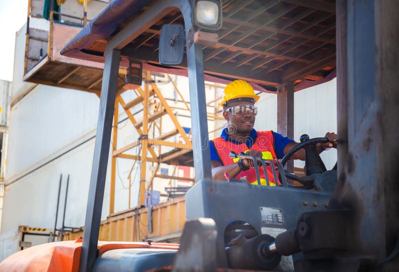 Happy Worker Man in Hardhat and Safety Vest Driving Container Stackers ...