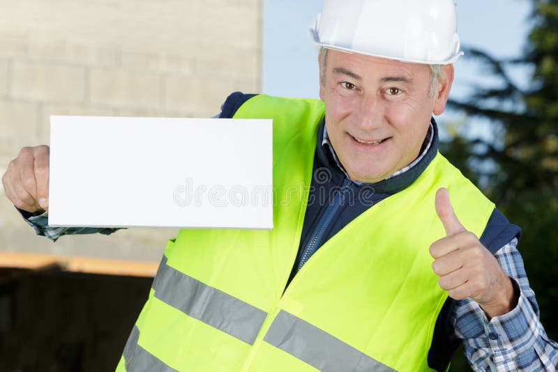 Happy Worker Presenting Empty Banner Stock Photo - Image of happy ...
