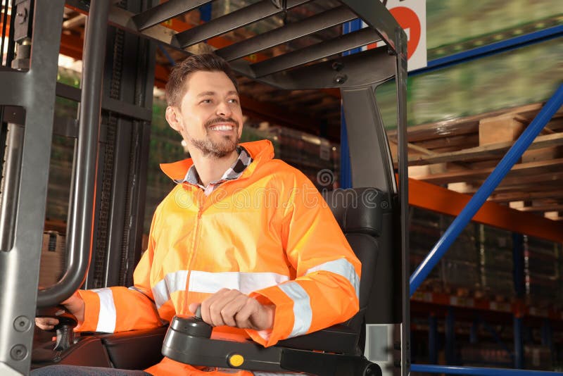 Happy Worker Sitting in Forklift Truck at Warehouse Stock Photo - Image ...