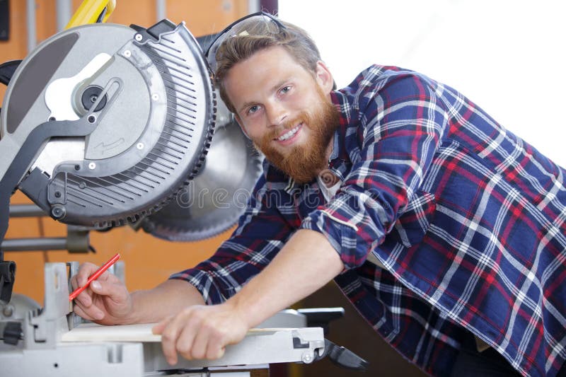 Happy Worker Using Electric Circular Saw Stock Photo - Image of ...