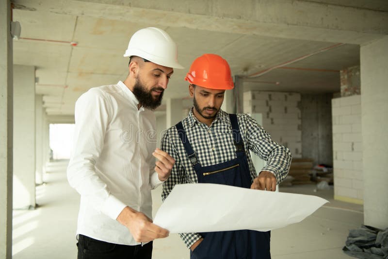 Happy Workers at Construction Site, Young Civil Engineer Manager and ...