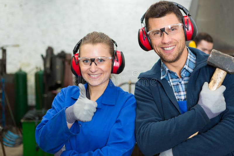 Happy workers in factory stock photo. Image of interior - 312437744