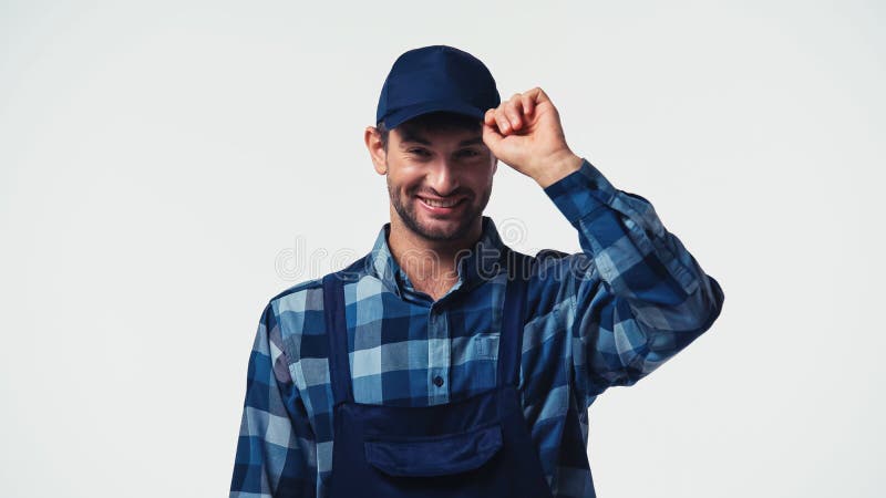 Happy Workman Adjusting Cap and Looking Stock Photo - Image of white ...