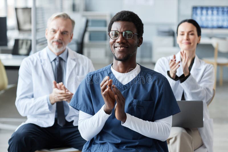 Young African American Assistant Showing and Explaining MRI Scan ...
