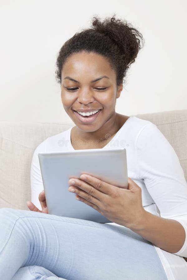 Happy Young African American Woman Using Tablet PC Stock Image - Image ...