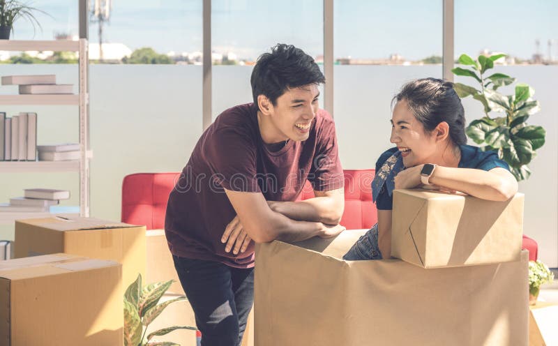 Happy Young Asian Couple Smiling Relaxing And Having Fun While Playing