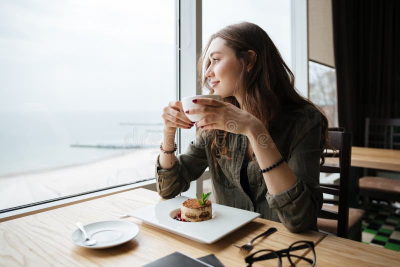 Happy Young Beautiful Lady Sitting in Cafe Drinking Coffee. Stock Image ...