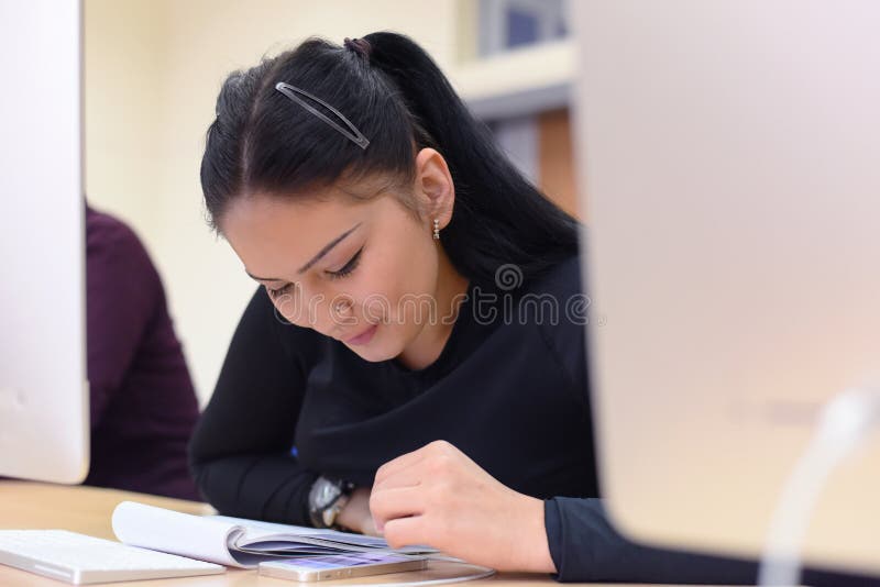 Happy Young Black-haired Female Student Using Phone during Comp Lab ...