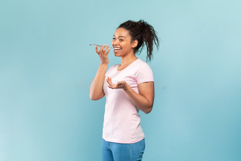Happy Young Black Lady Using Voice Assistant on Smartphone, Gesturing ...