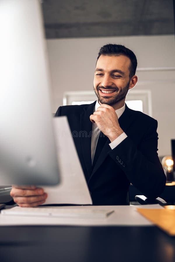 Happy Young Boss Reading Documents in His Office Stock Image - Image of ...