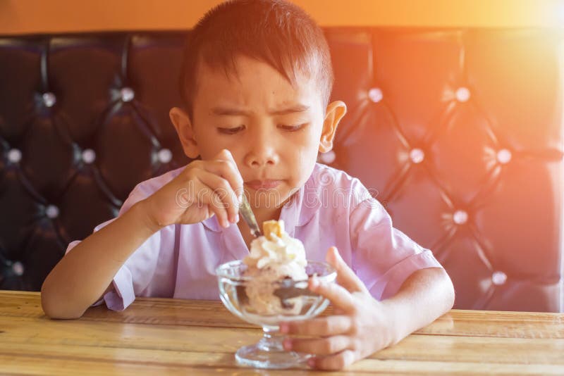 Happy Young Boy Eating a Tasty Ice Cream Stock Photo - Image of closeup ...