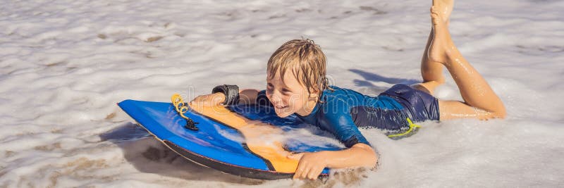 Happy Young Boy Having Fun at the Beach on Vacation, with Boogie Board ...