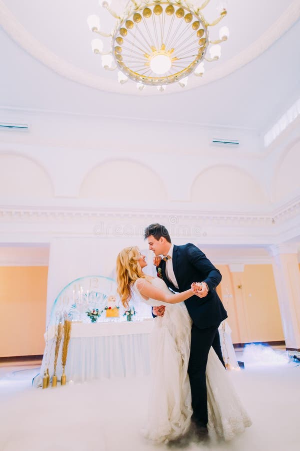 Happy Young Bride and Groom Dance in the Wedding Hall Stock Photo ...