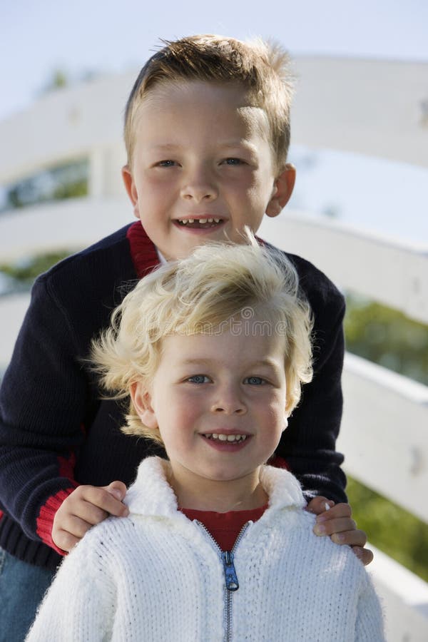 Happy Little Kids Smiling at the Park As they Peek Out the Window of a ...